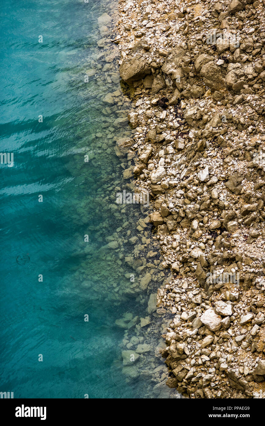 Texture of limestone rocks and turquoise water Stock Photo - Alamy