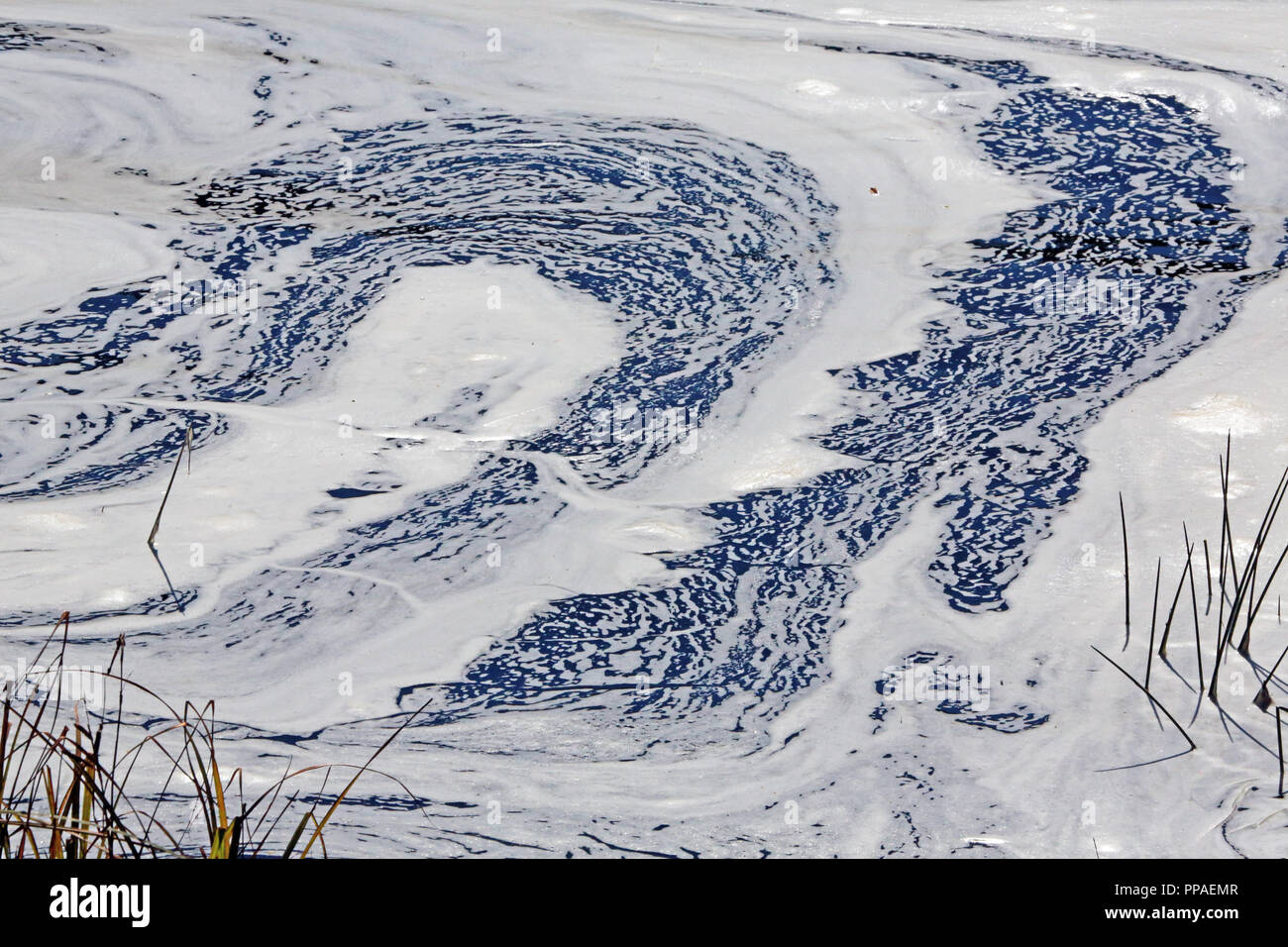 frothy swirling foamy water below saw mill dam Stock Photo - Alamy
