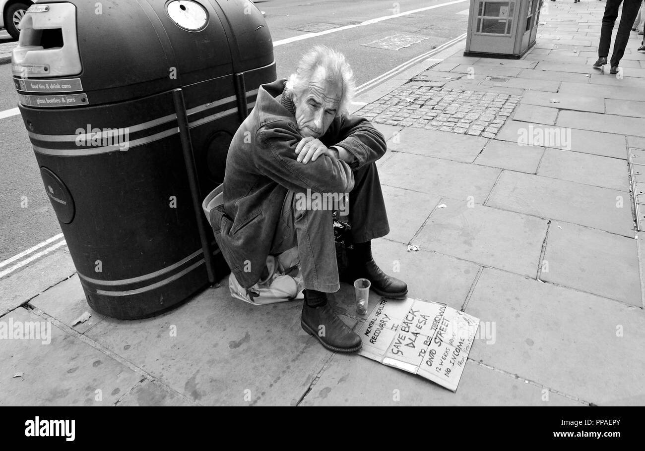 Homeless black man sleeping on street Black and White Stock Photos ...