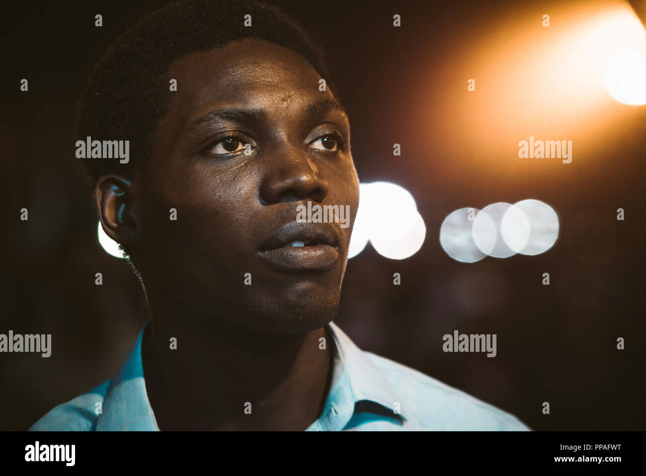 Nigerian man at night Stock Photo - Alamy