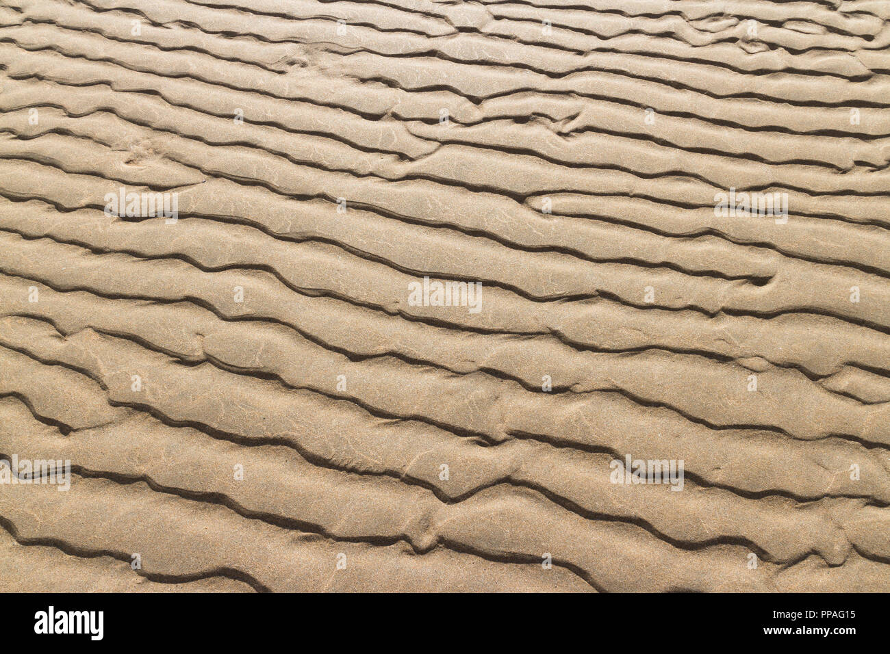 Patterns in sandy beach Stock Photo - Alamy