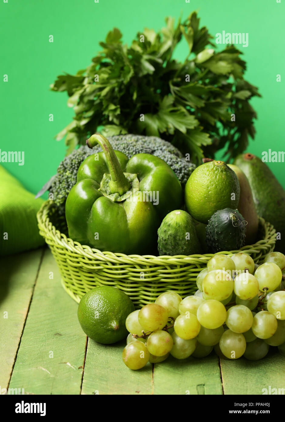 green vegetables and fruits in a wicker basket Stock Photo - Alamy
