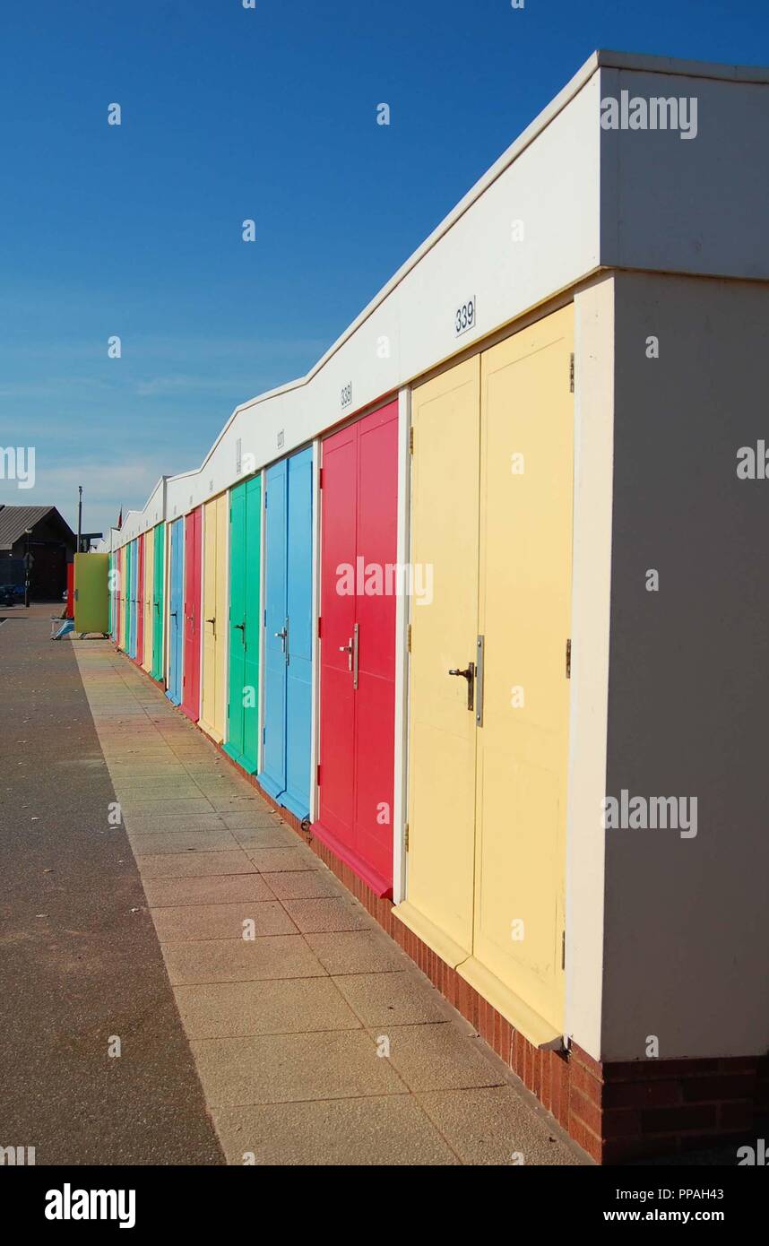 Row of colourful huts at the seaside Stock Photo - Alamy