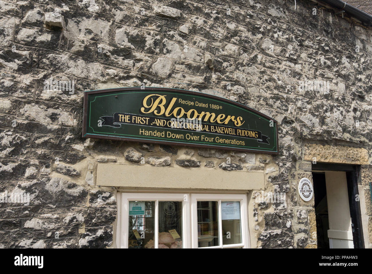 Sign outside Bloomers, a Bakewell Pudding shop, Bakewell, Derbyshire ...