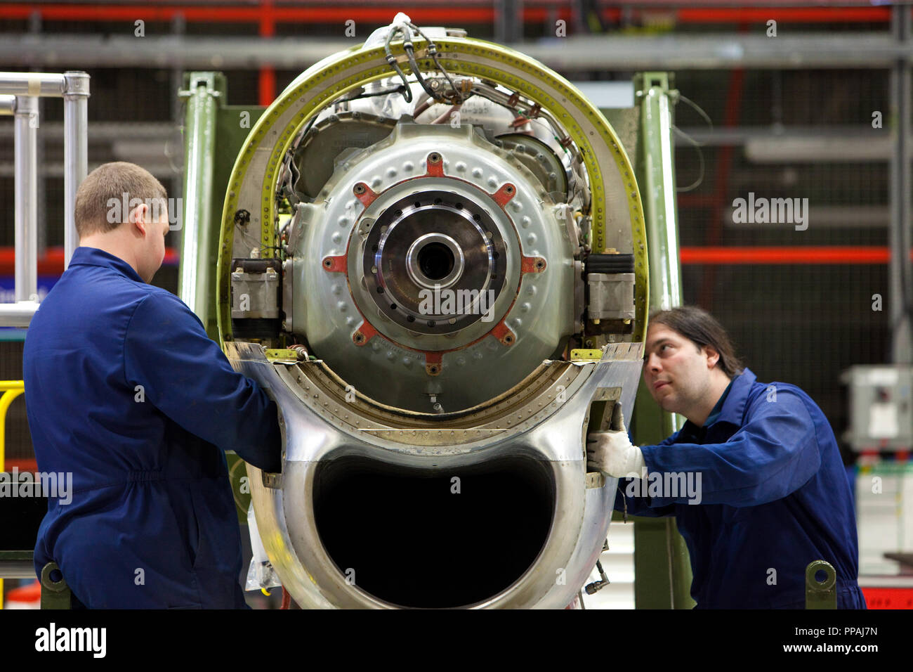 Aircraft Technicians working on engine Stock Photo - Alamy