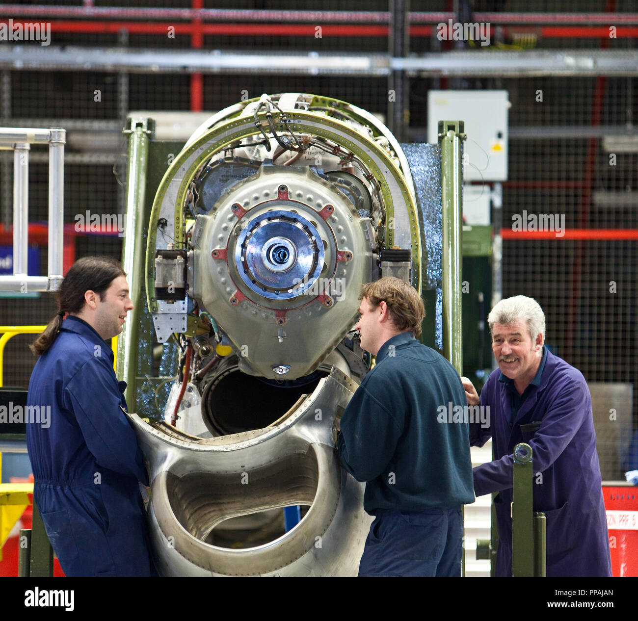 Aircraft Technicians working on engine Stock Photo - Alamy