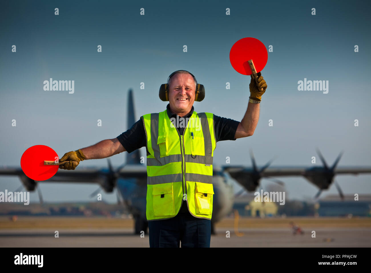 Aircraft marshall on runway Stock Photo - Alamy