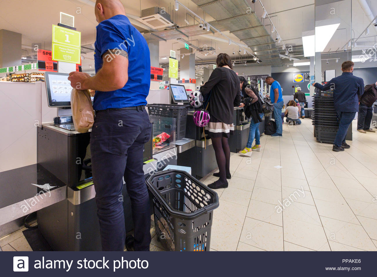 Self Service Checkout Customer Stock Photos & Self Service Checkout ...