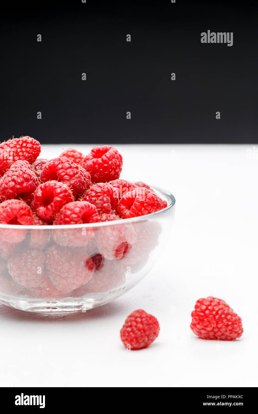 Photo of raspberries in transparent cup Stock Photo - Alamy