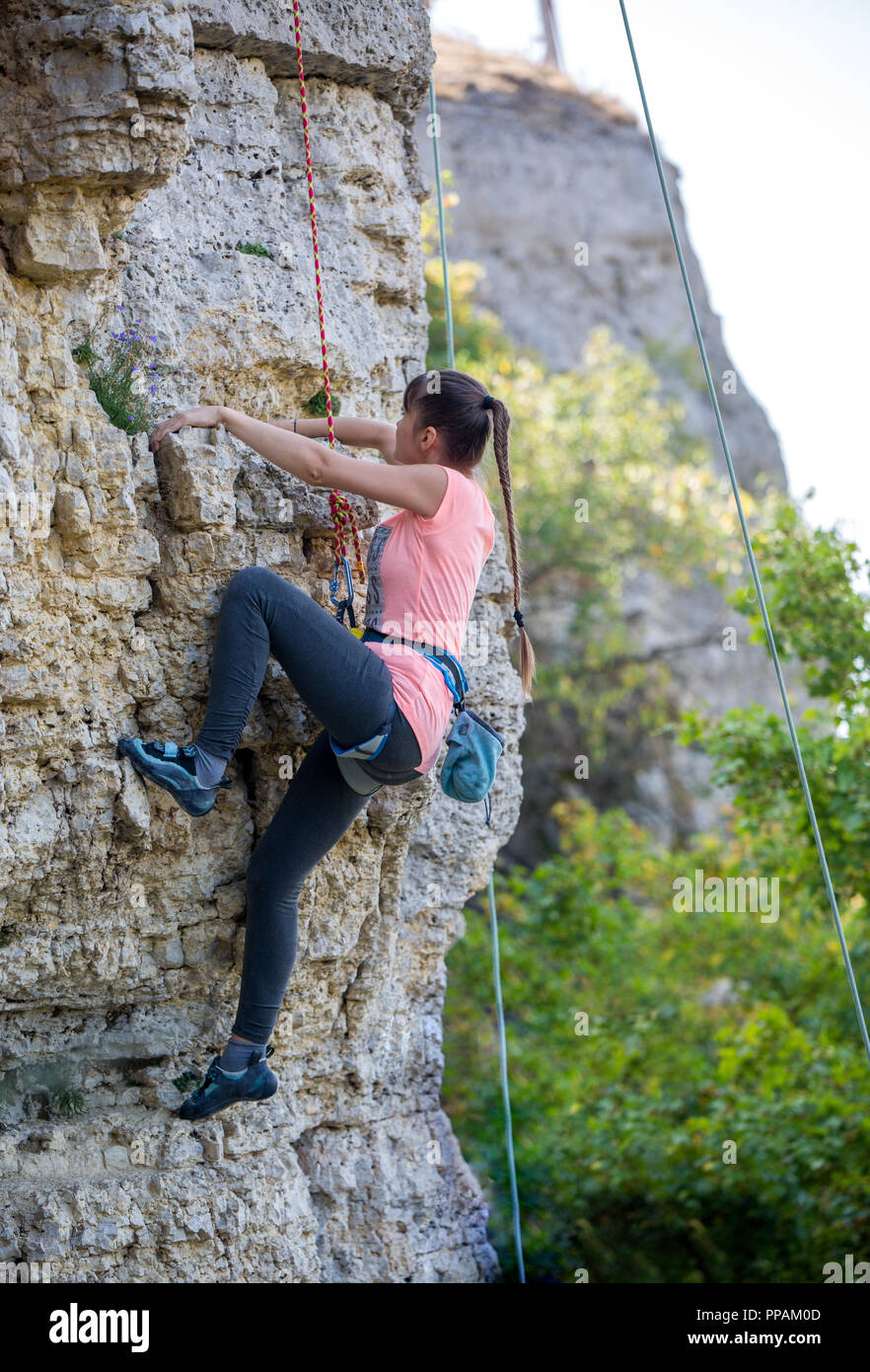 Photo of sports woman climbing mountain Stock Photo - Alamy