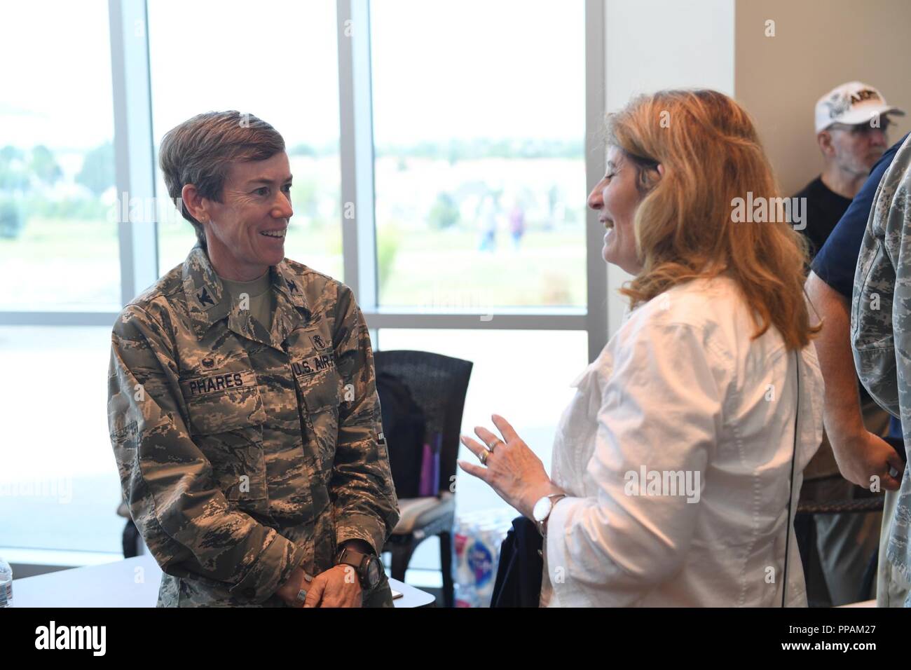 Col. Shannon Phares, 460th Medical Group commander, speaks to an ...