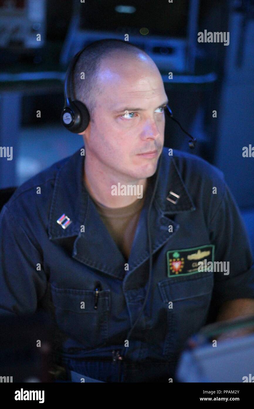 STRAIT OF HORMUZ (Aug. 28, 2018) Lt. Adam Cline stands watch as ...
