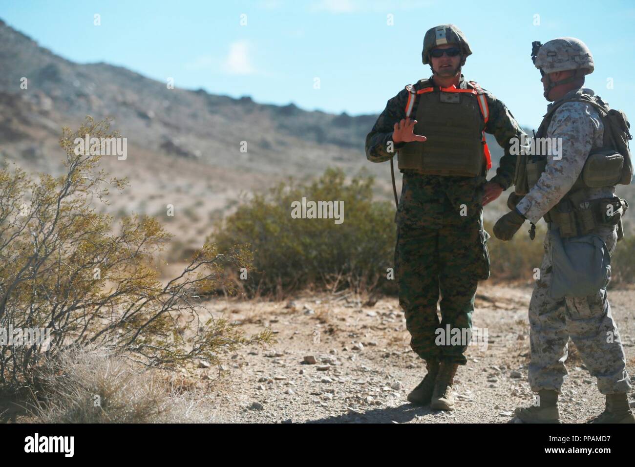 Brig. Gen. Roger Turner, Combat Center Commanding General, talks with ...