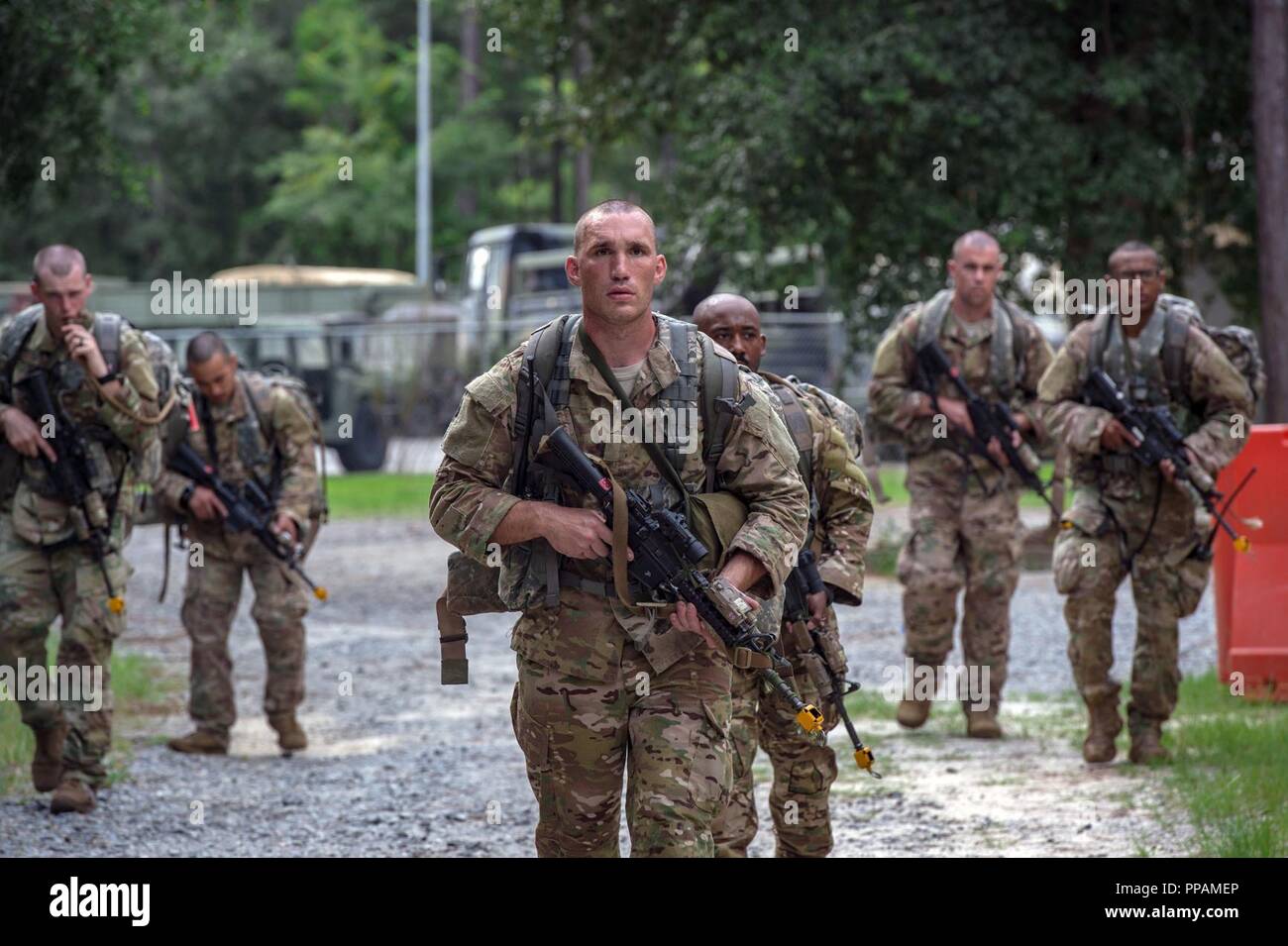Airmen advance through a simulated battlefield during a Pre-Ranger ...