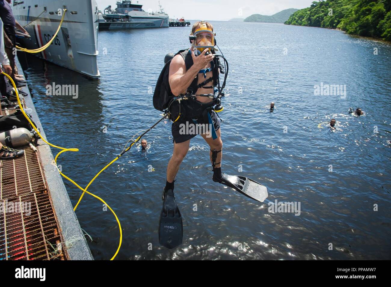 Members of the Trinidad and Tobago Coast Guard dive team observe U.S ...