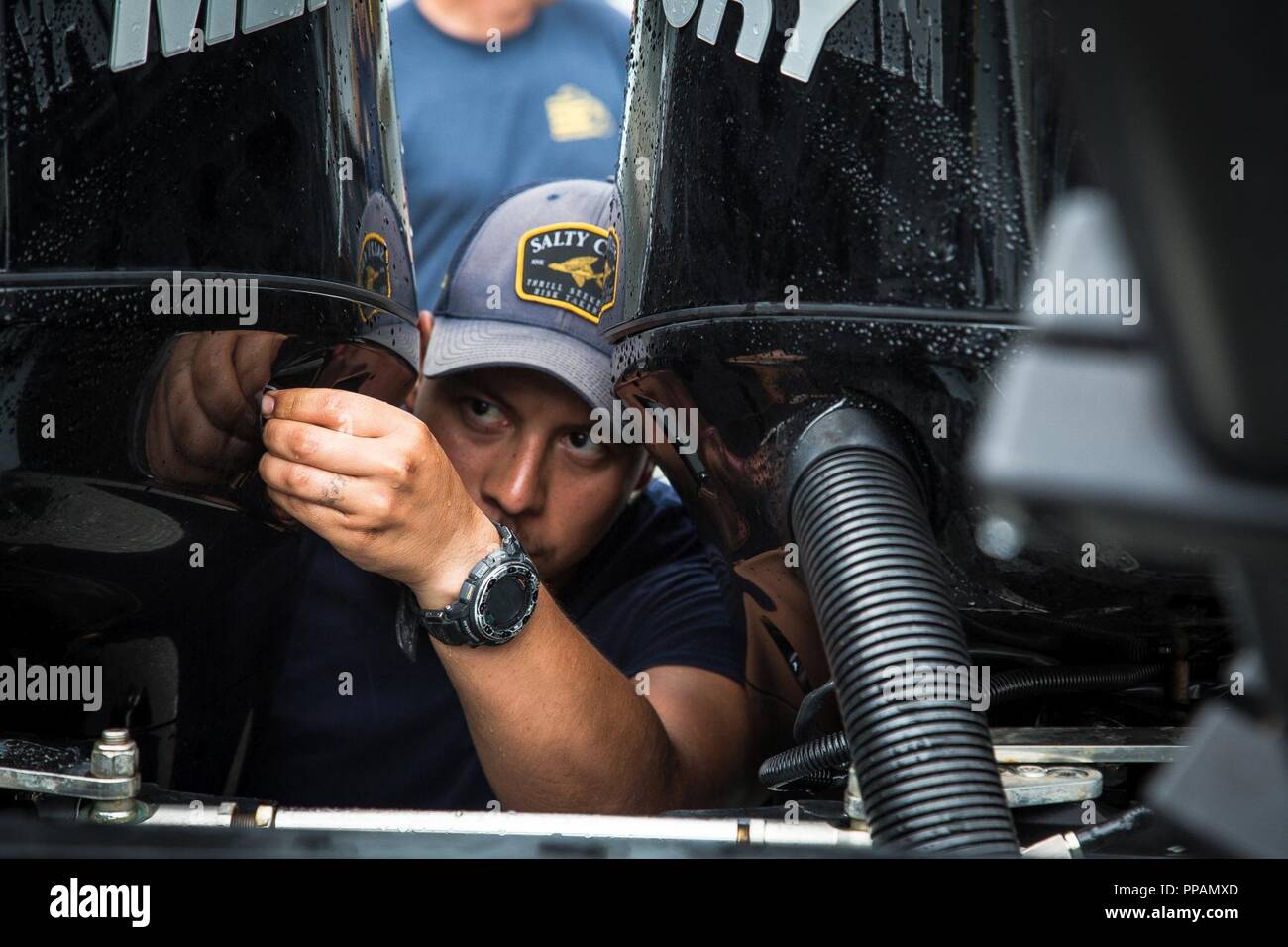 U.S. Navy Diver 1st Class Jonathan Miranda, assigned to Mobile Diving ...