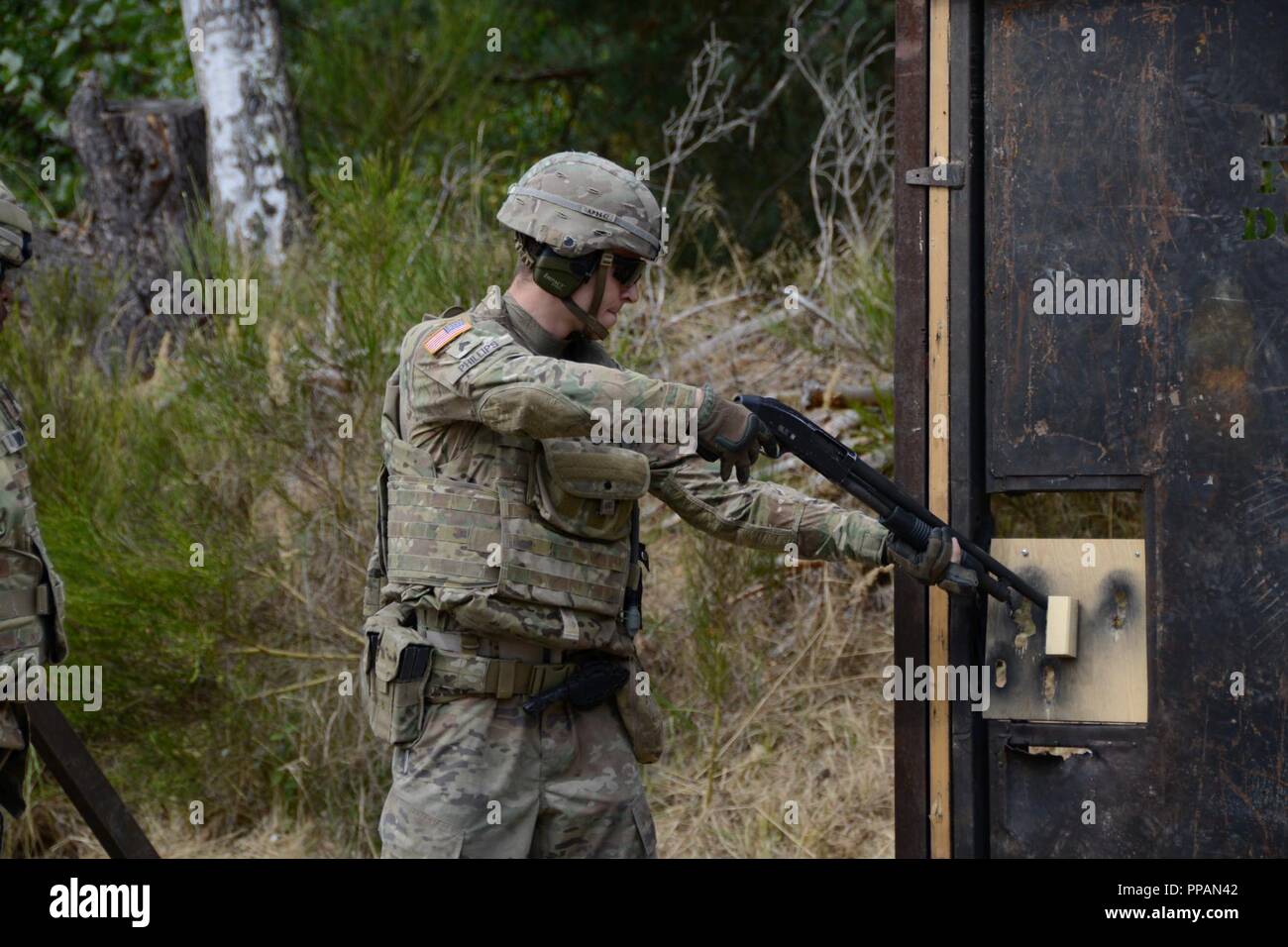 A U.S. Soldier assigned to the 2nd Cavalry Regiment uses an M500 ...