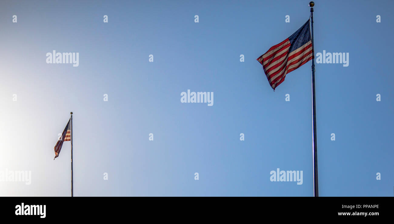 American Flags waving in the wind beneath the sky Stock Photo - Alamy