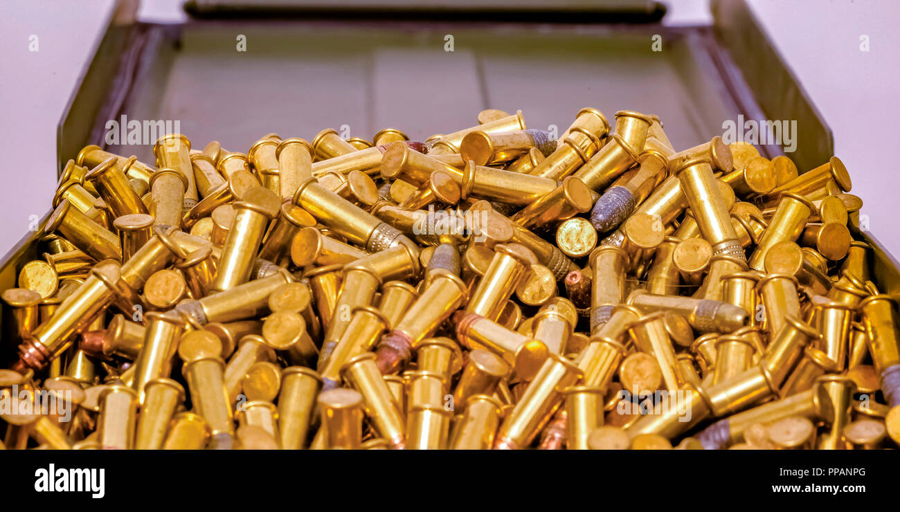 Ammunition box filled with golden bullets Stock Photo - Alamy