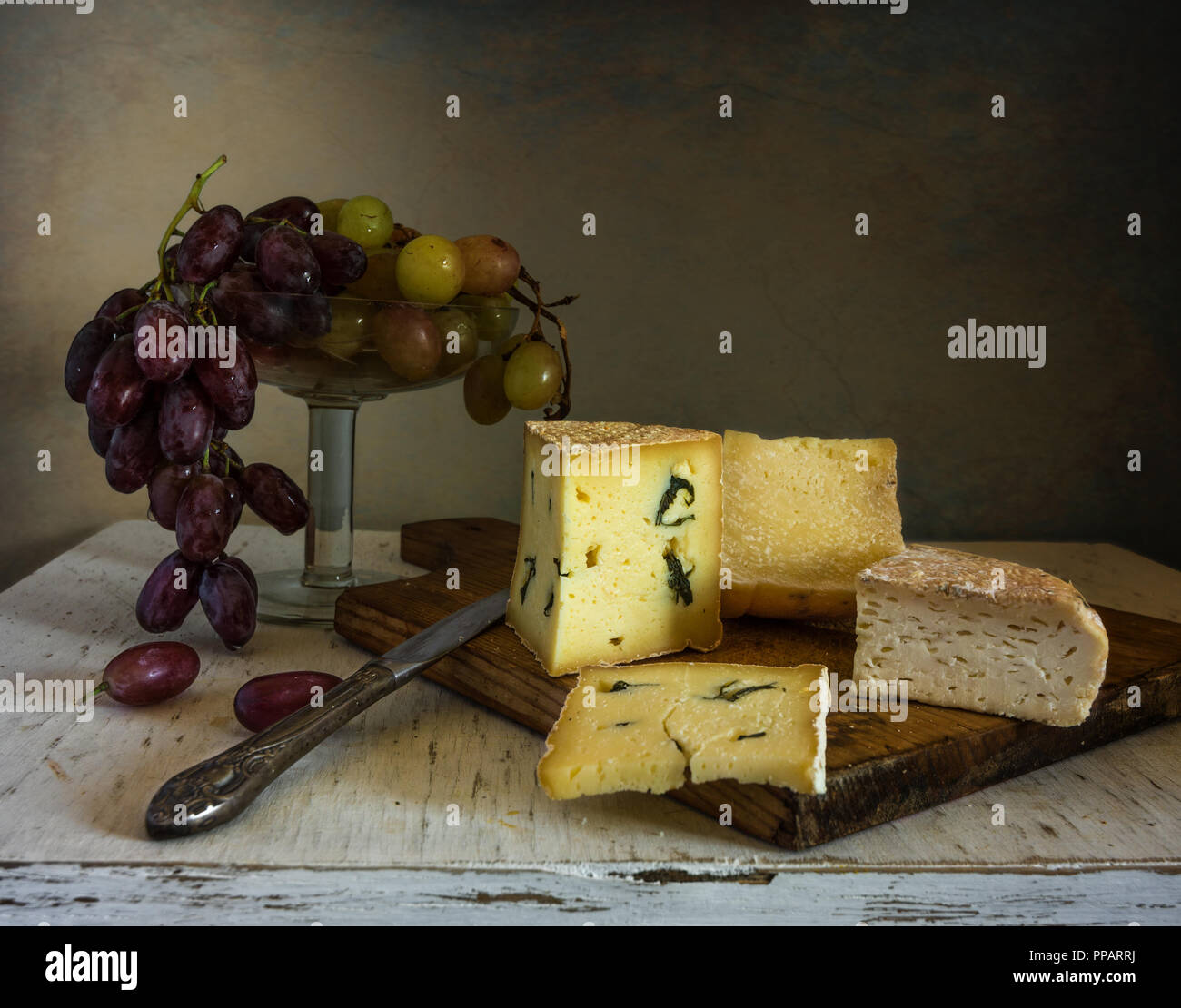 still life with pieces of cheese and grapes. food. delicious. vintage ...