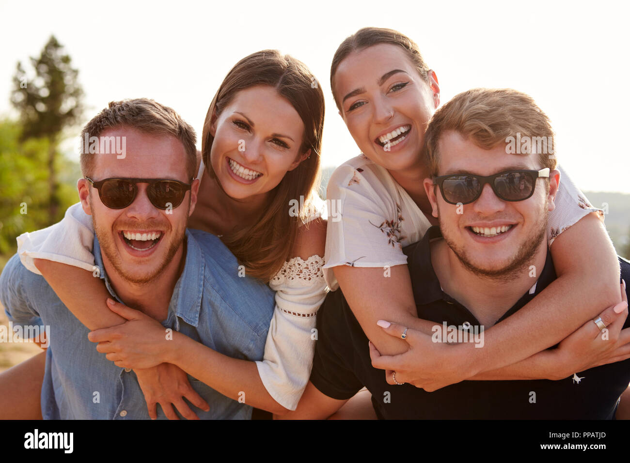 Portrait Of Young Couples Having Fun On Holiday Together Stock Photo ...