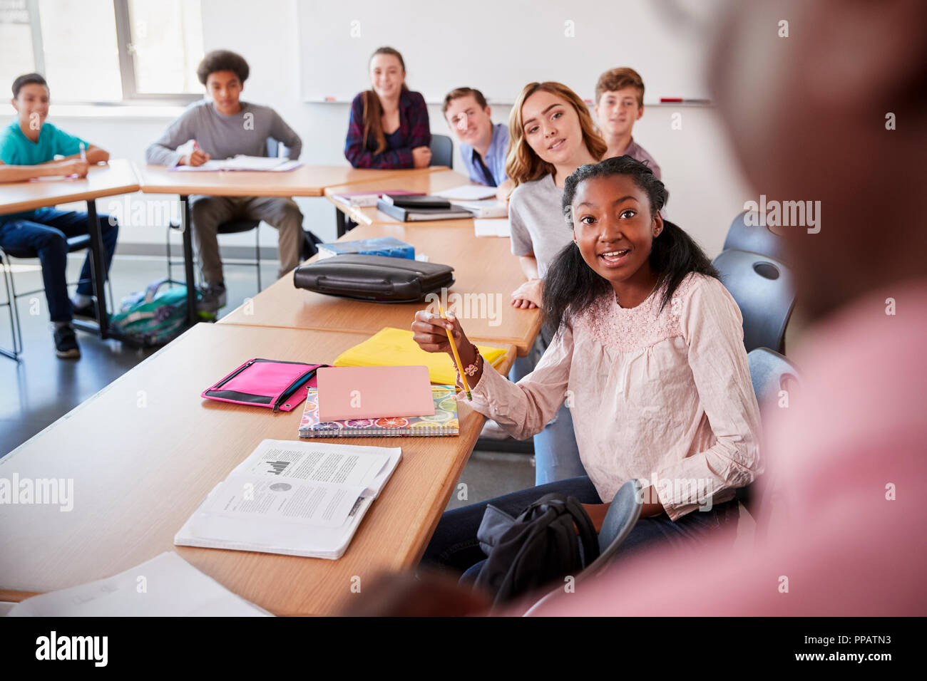 Male High School Tutor Standing At Whiteboard Teaching Class Stock ...