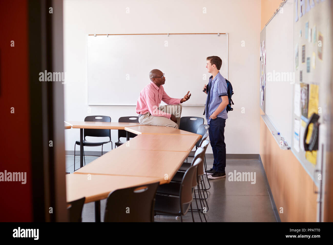 Teacher talking to student classroom hi-res stock photography and ...