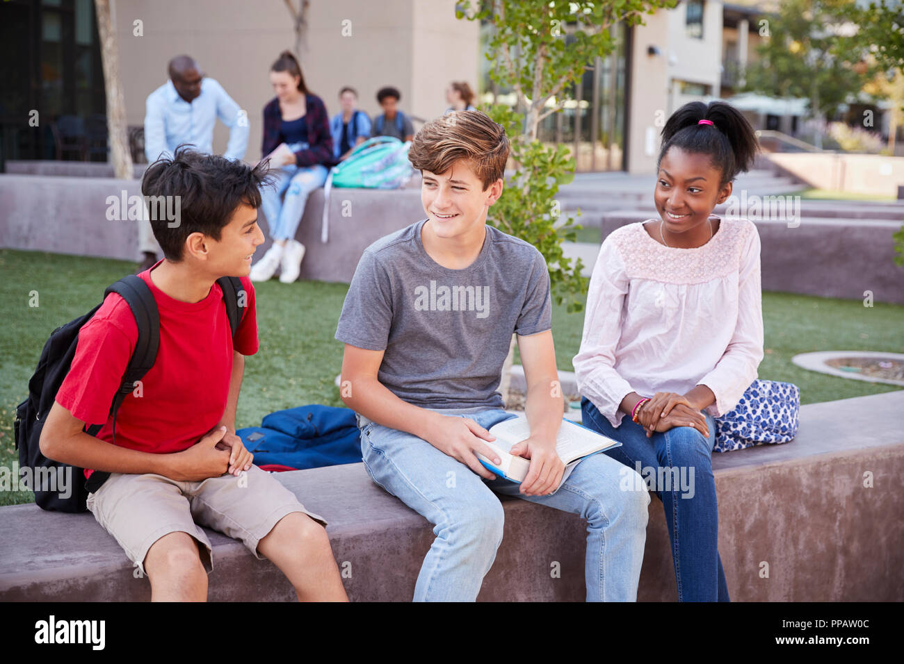 Group Of High School Students Studying Outdoors During Recess Stock ...