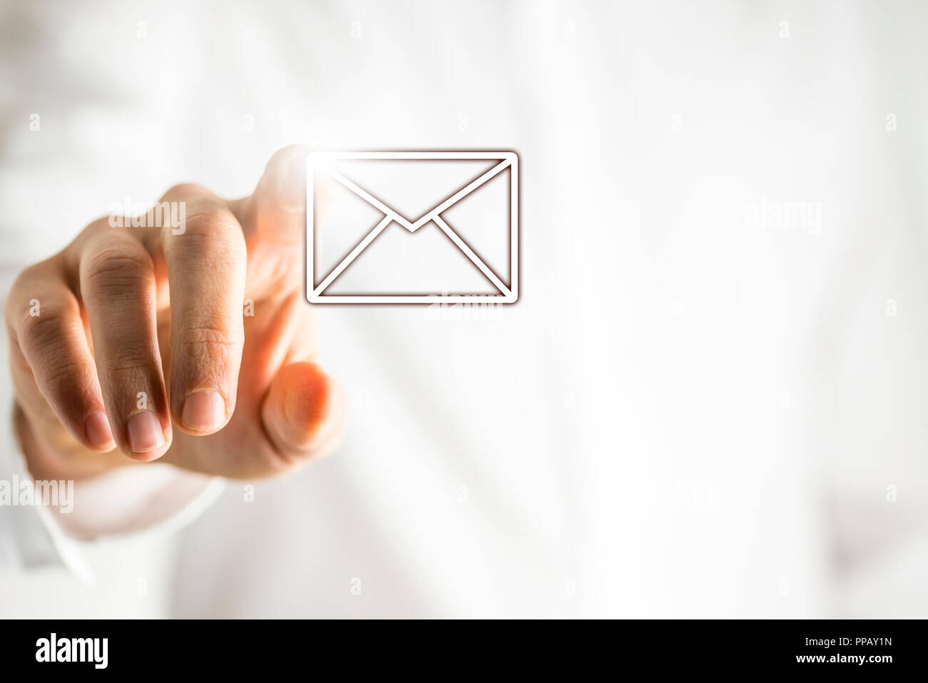 Choosing email icon on virtual interface Stock Photo - Alamy