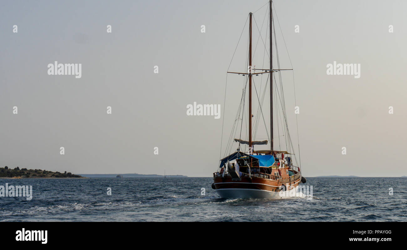 Traditional Turkish Boat or Gulet sailing view from rear in Aegean sea ...