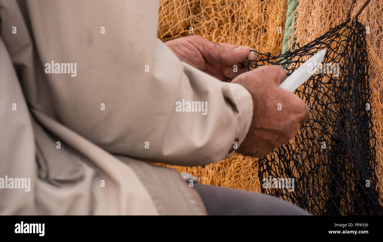 Fishing net repair hi-res stock photography and images - Alamy