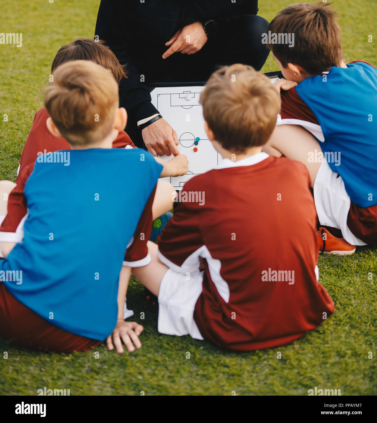 Kids Football Team with Coach at the Soccer Field. Youth Coach ...