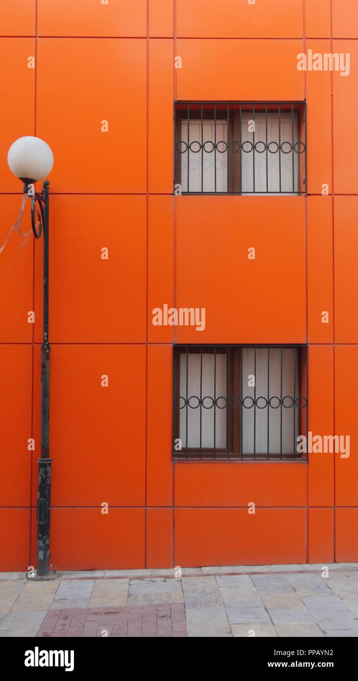 Orange house facade with streetlight in the street Stock Photo - Alamy