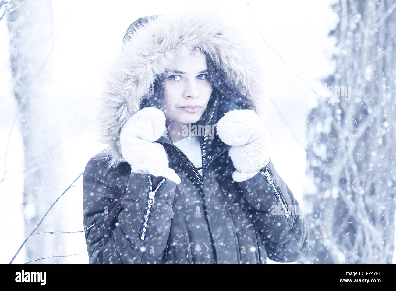 Beautiful girl in a beautiful winter snow Stock Photo - Alamy