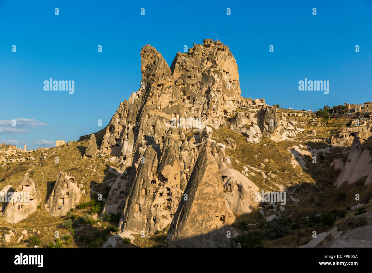 Uchisar Castle in Cappadocia at sunset Stock Photo - Alamy
