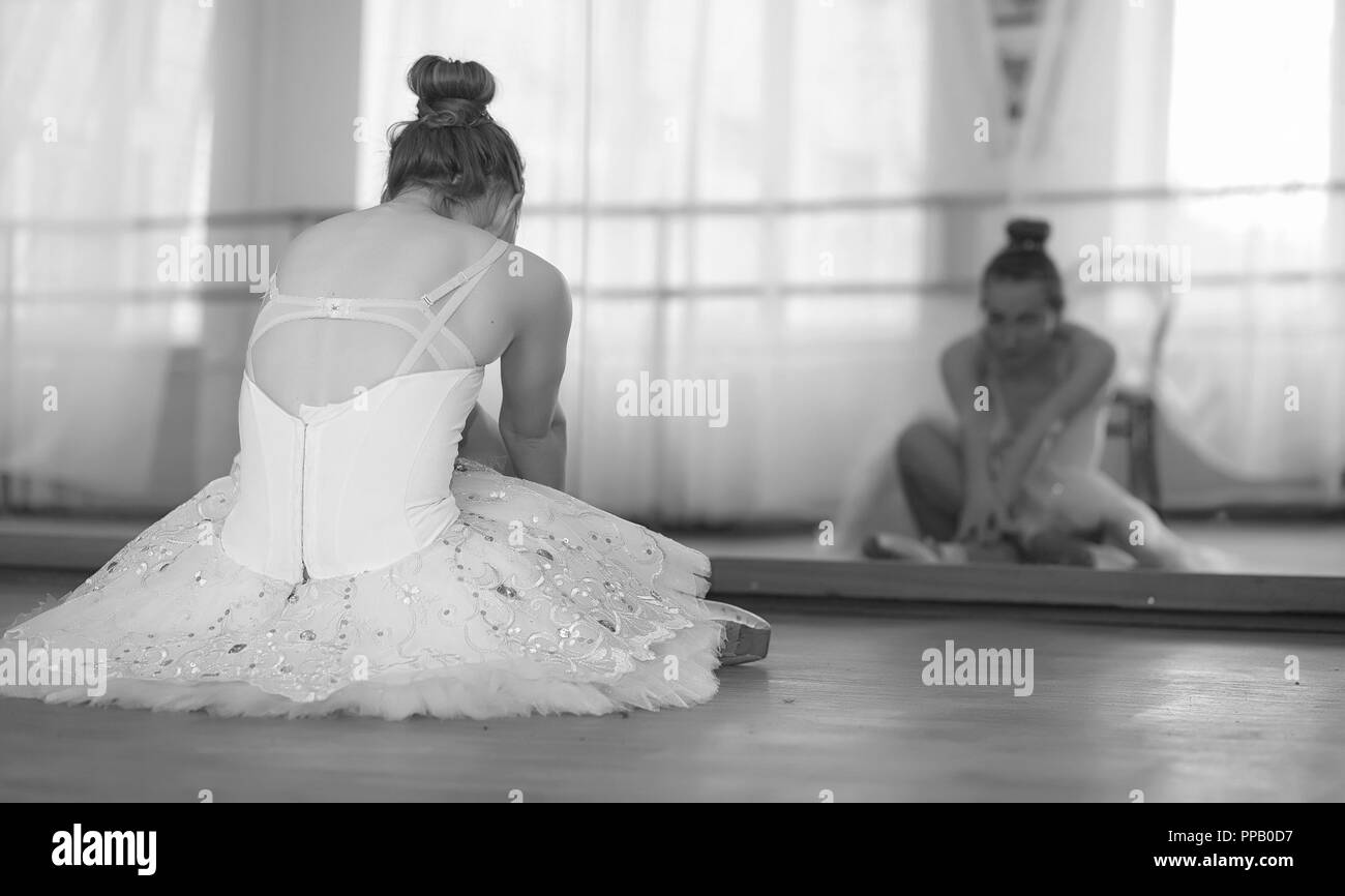 Young ballet dancer on a warm-up. The ballerina is preparing to Stock ...
