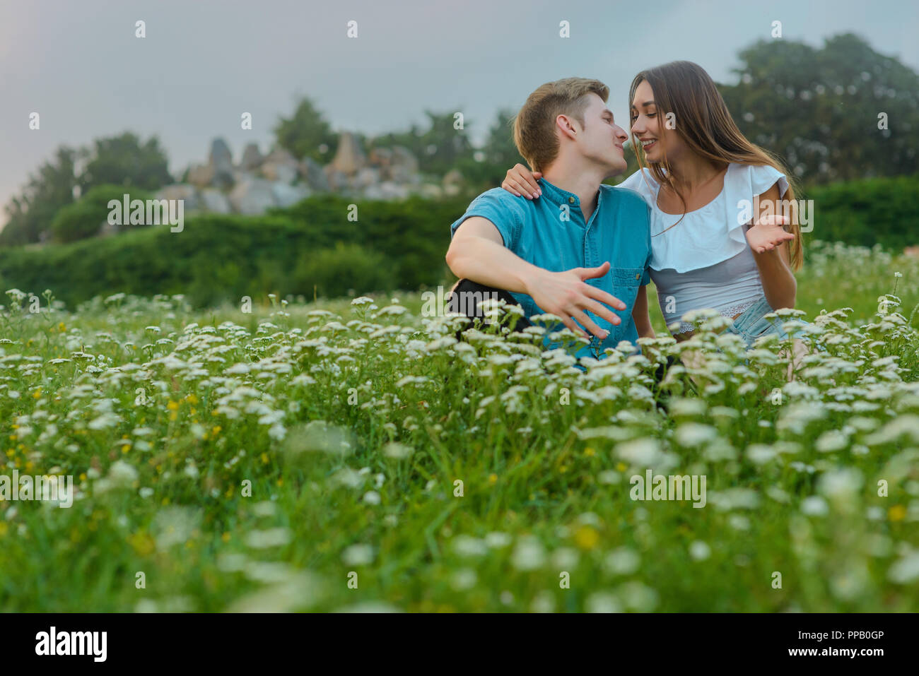 Funny boy and girl talk to each other Stock Photo - Alamy