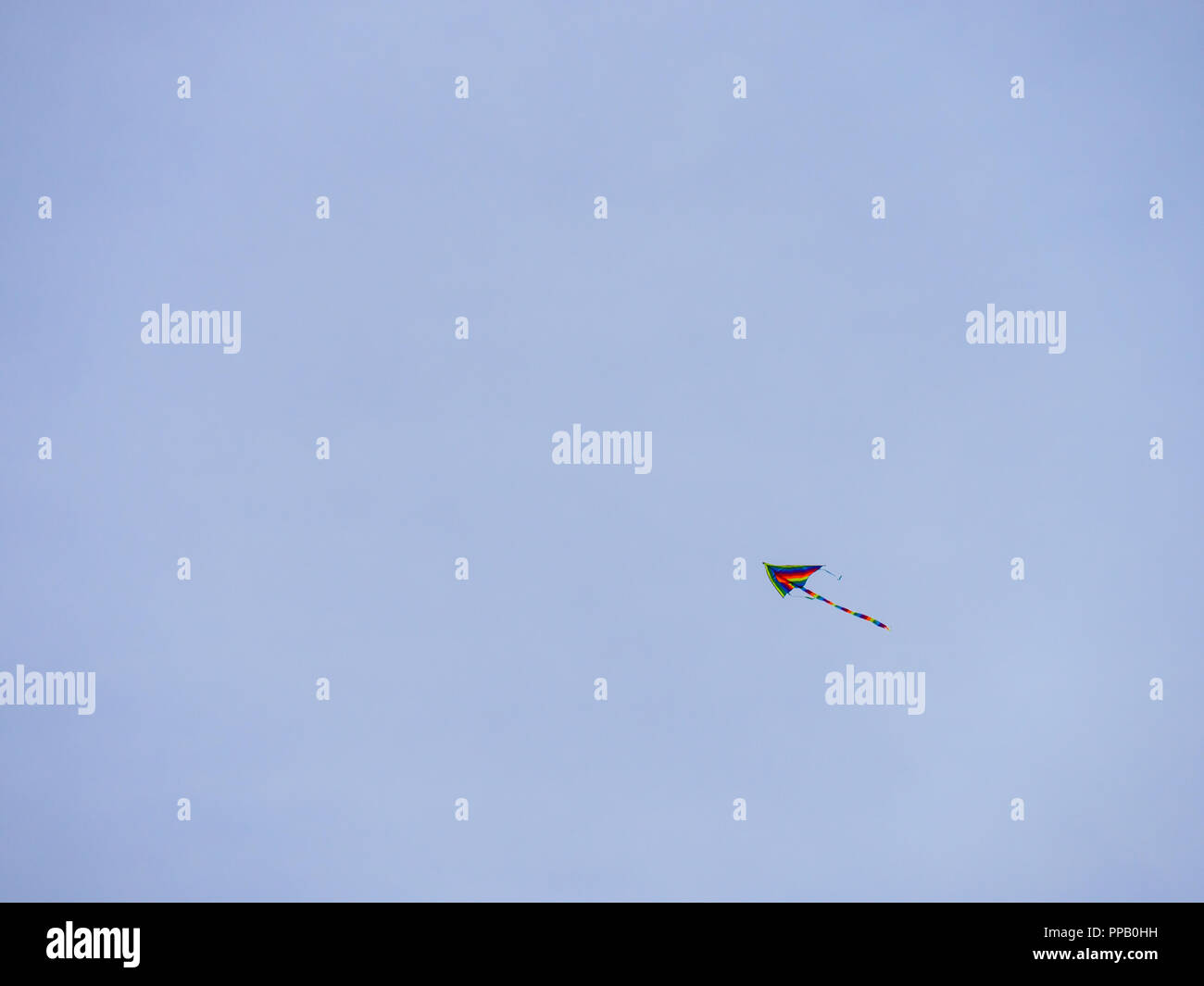 colorful kite flying high in the sky Stock Photo - Alamy