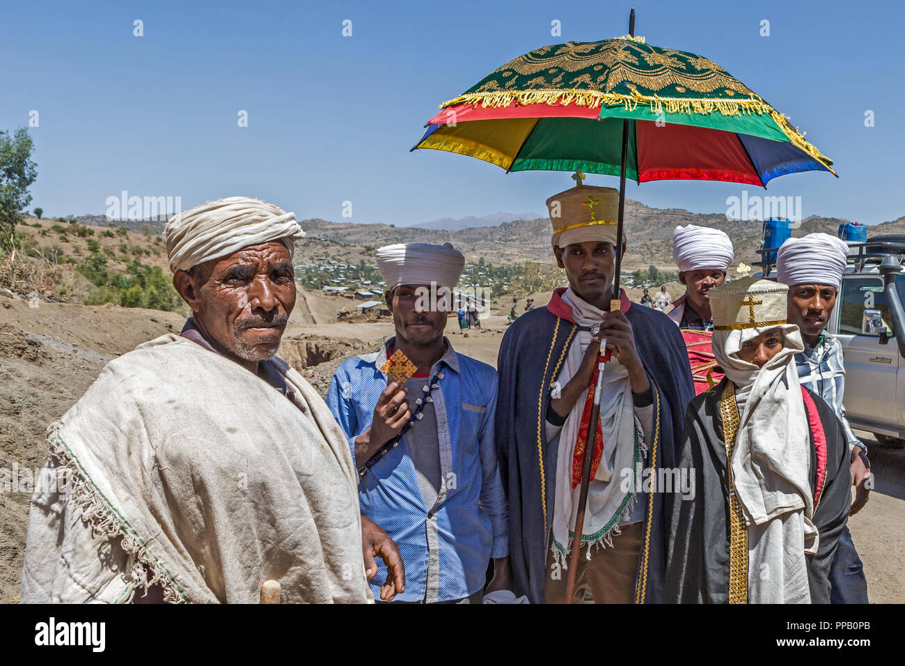 Local religious wedding procession of groom taking wife from her house ...
