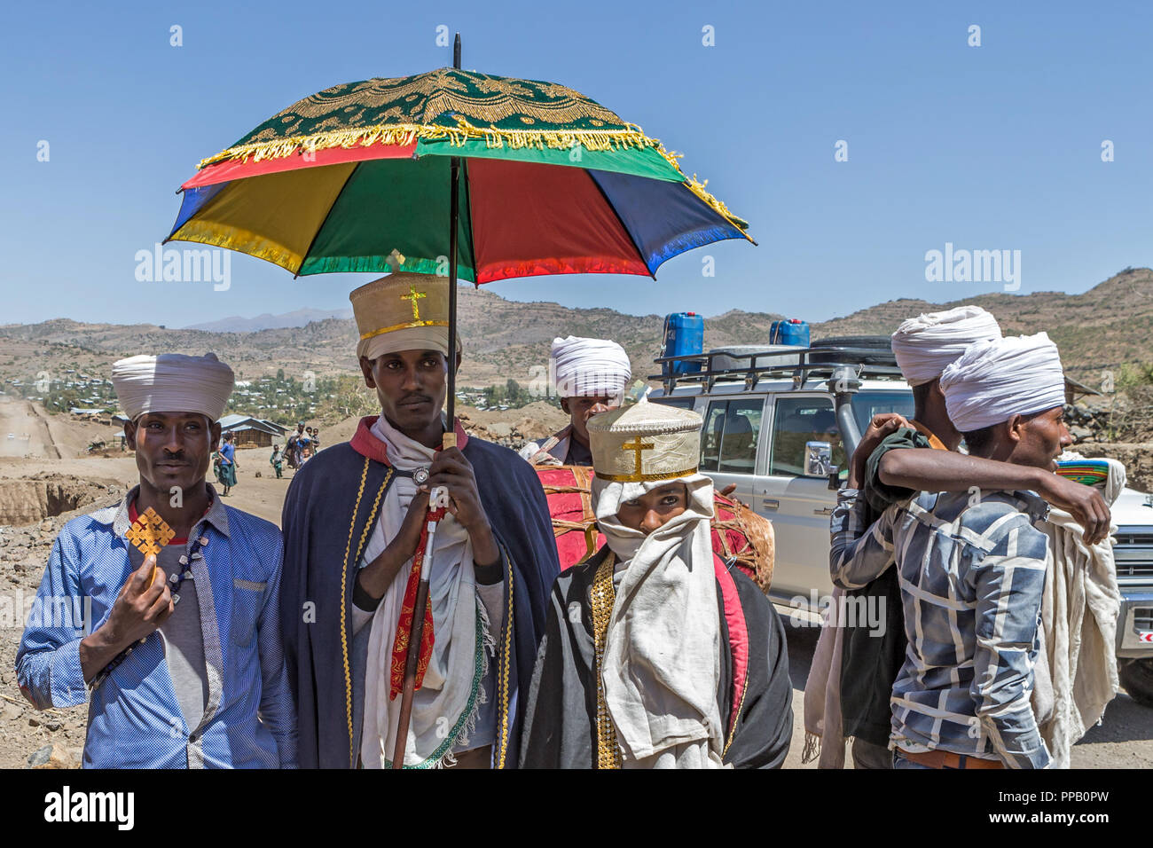 Local religious wedding procession of groom taking wife from her house ...