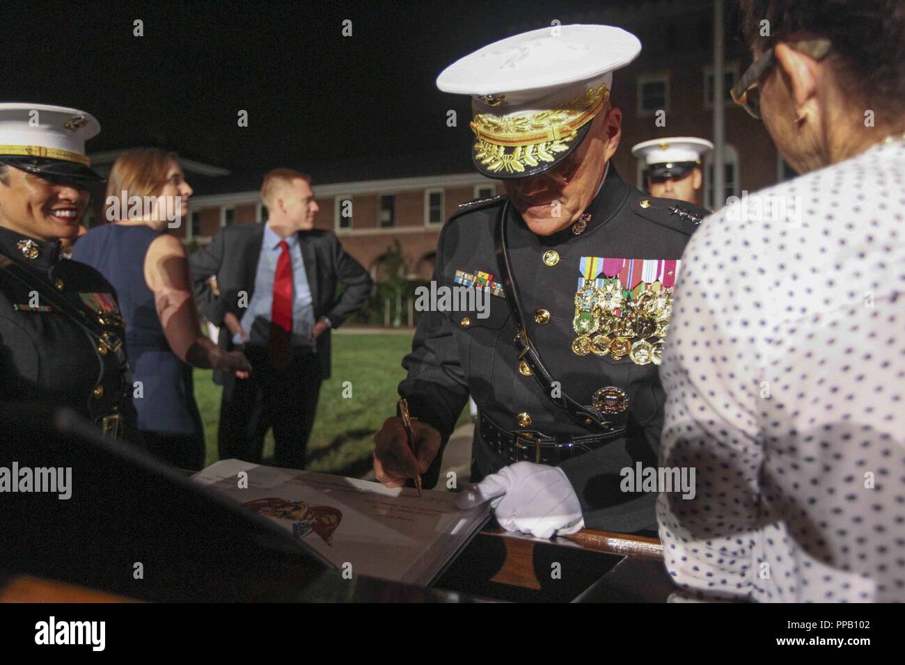 Commandant of the Marine Corps Gen. Robert B. Neller signs the official ...
