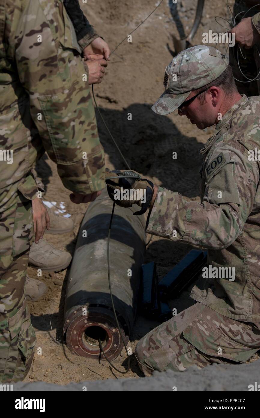 U.S. Air Force explosive ordnance disposal technicians prepare to ...