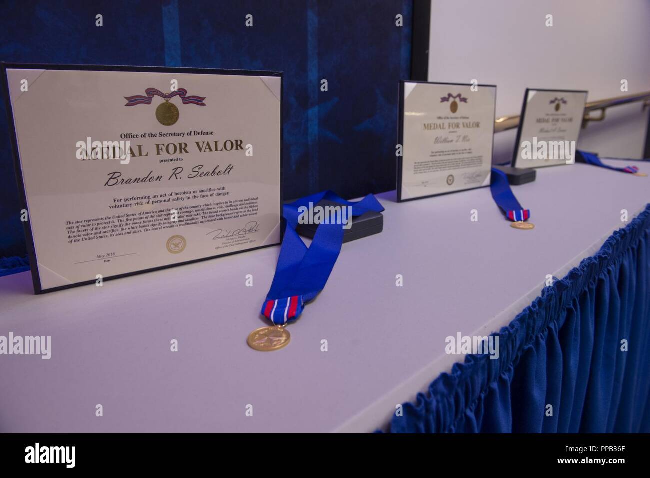Medal of Valor certificates sit on a table before the Medal of Valor ...