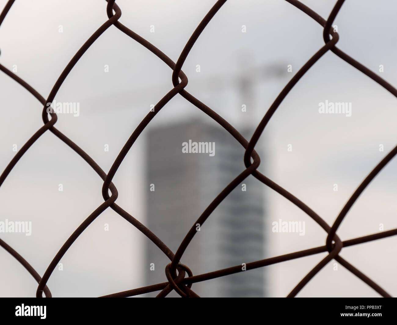 blurred not in focus corporate building behind the cage fence Stock ...