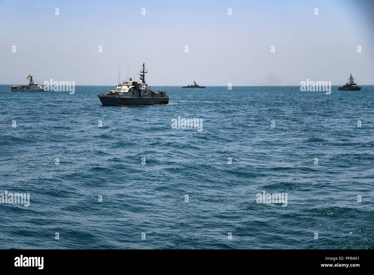 ARABIAN GULF (Aug. 14, 2018) From left to right, U.S. Coast Guard ...