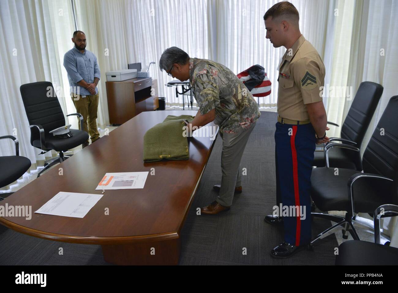 Robert Marzo and U.S. Marine Corps Cpl. Nathaniel Walters secure the ...