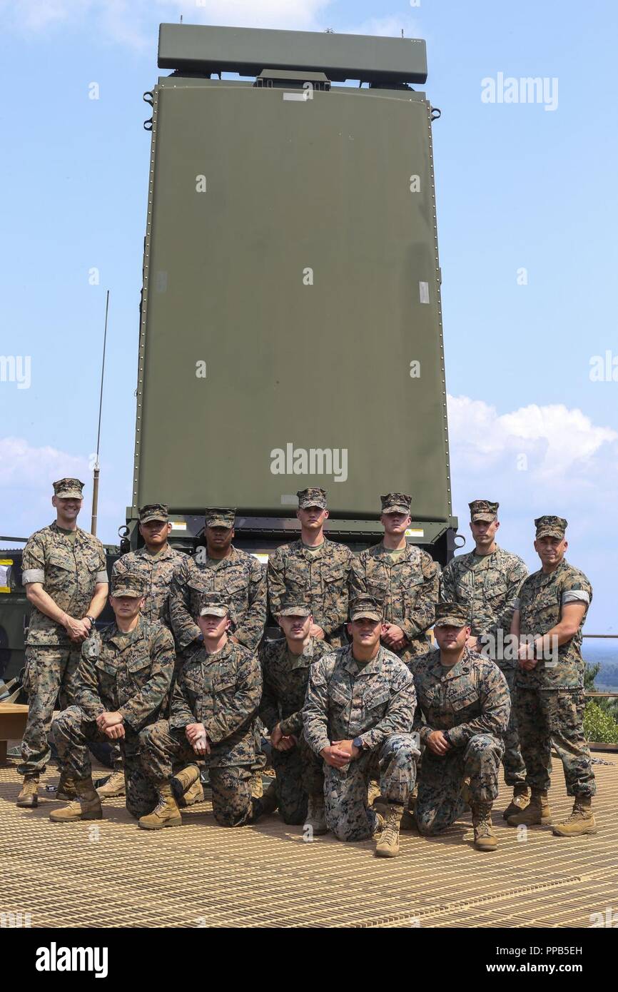 Marines with Marine Air Control Squadron (MACS) pose in front of a TPS ...