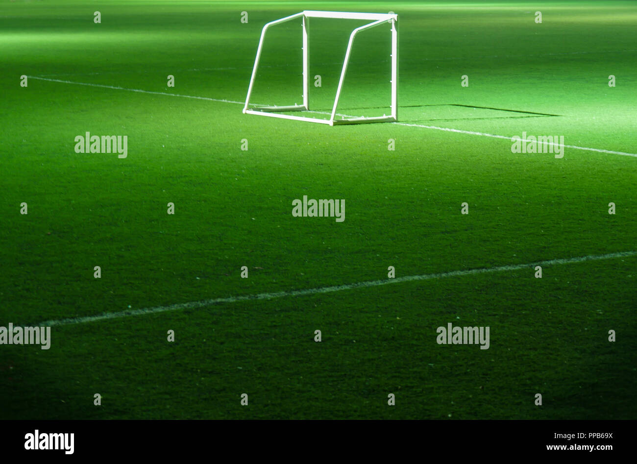 Empty soccer goal on a night Stock Photo - Alamy