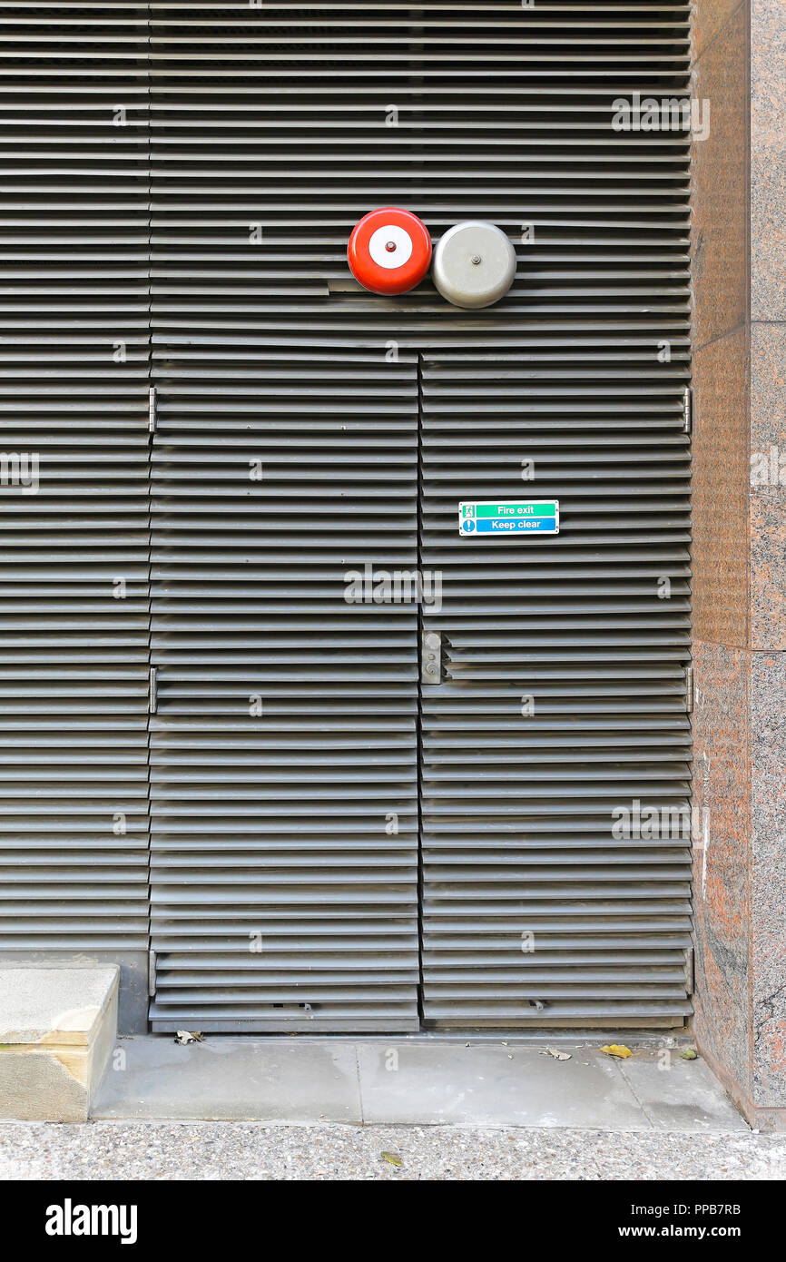 Fire exit with alarm bell safety system Stock Photo - Alamy