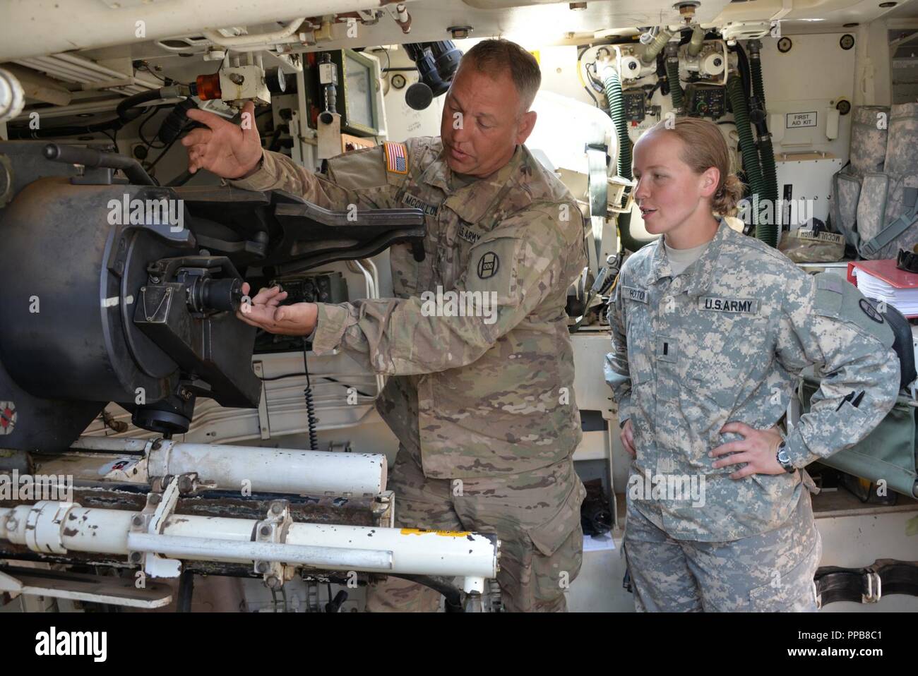 Staff Sgt. Jeffrey McCullough (left), Gun Chief for Charlie Battery 1 ...